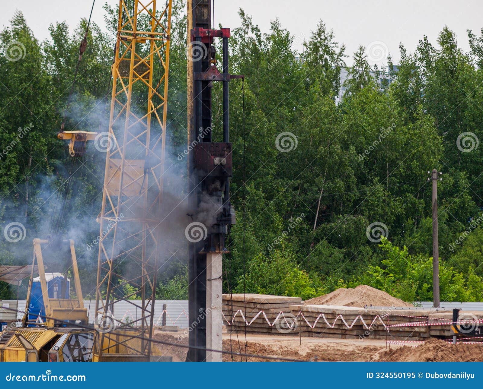 A Machine Driving Piles at Construction Sites during the Construction ...