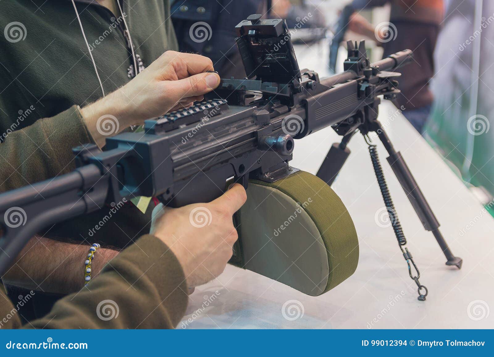 Machine Gun in the Hands of a Man Stock Photo - Image of black, gunner ...