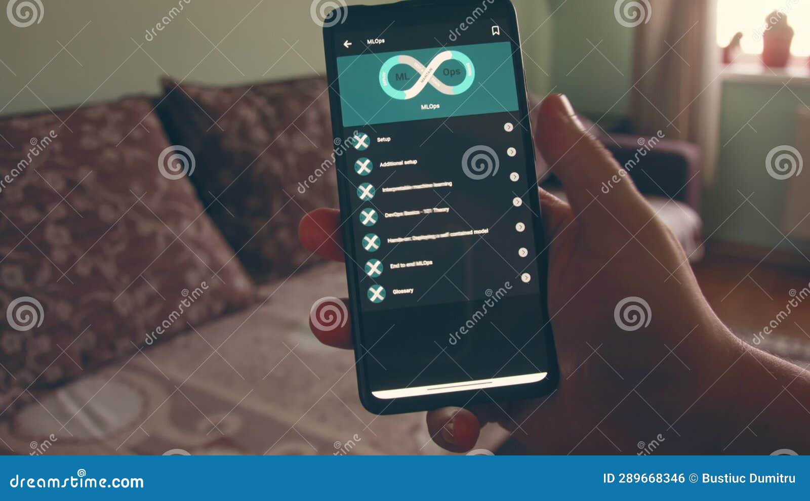 Machine Learning Develops. ML Ops. Information on Mobile Phone Screen ...