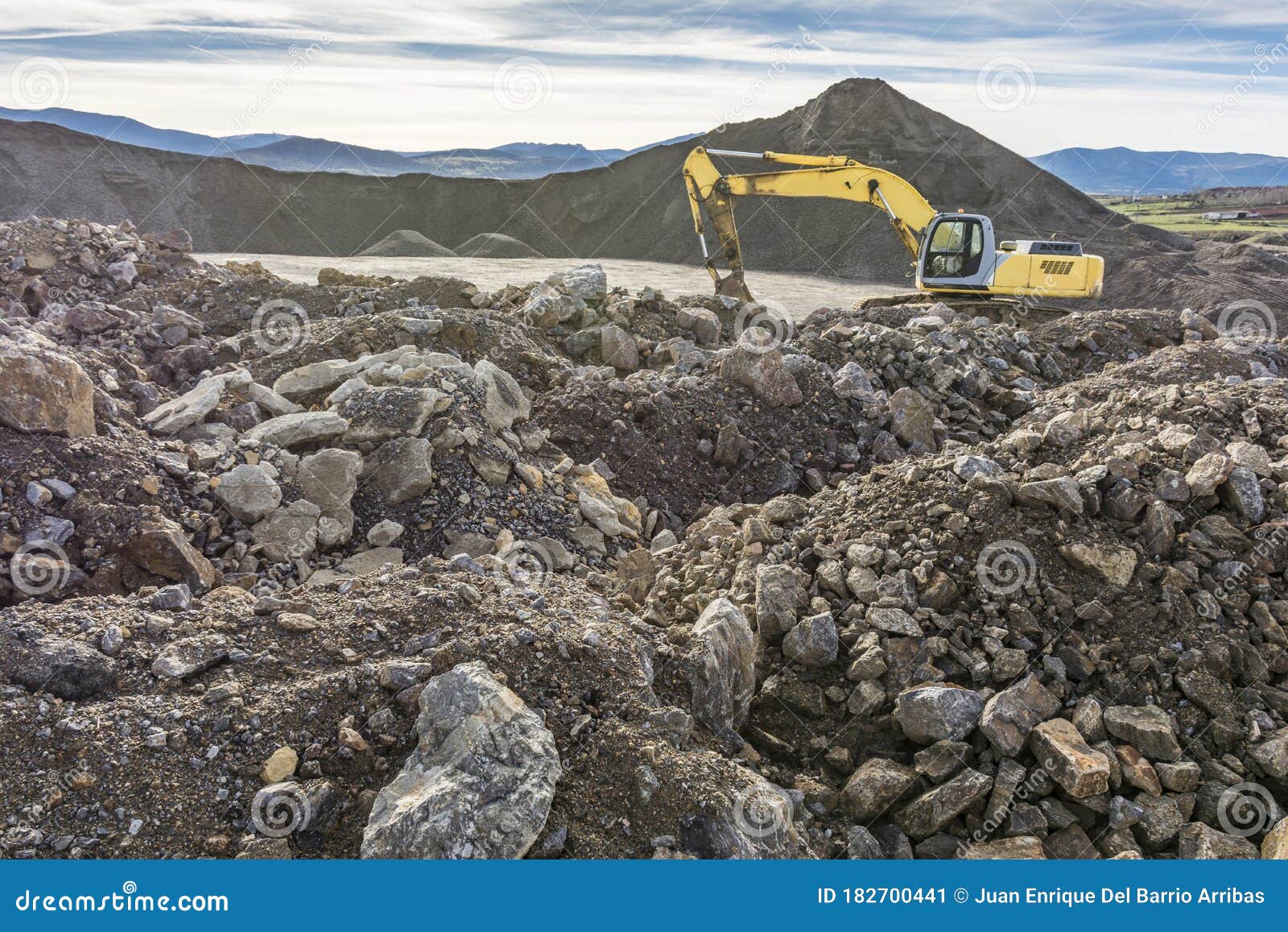 Machine Moving Rock into a Quarry To Transform into Gravel Stock Image ...