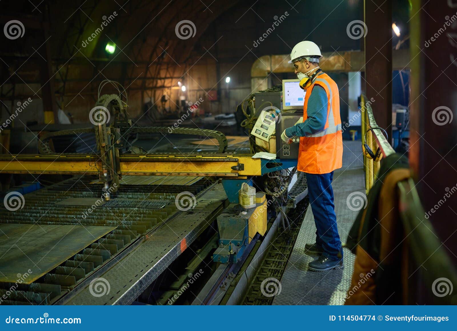 Machine Operator Focused on Work Stock Photo - Image of helmet ...
