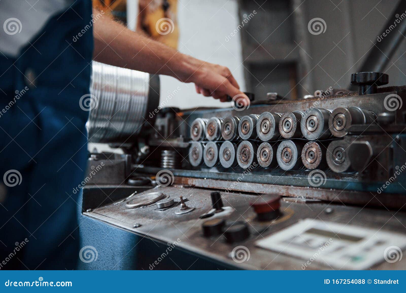 Machine Operator. Man in Uniform Works on the Production Stock Photo ...