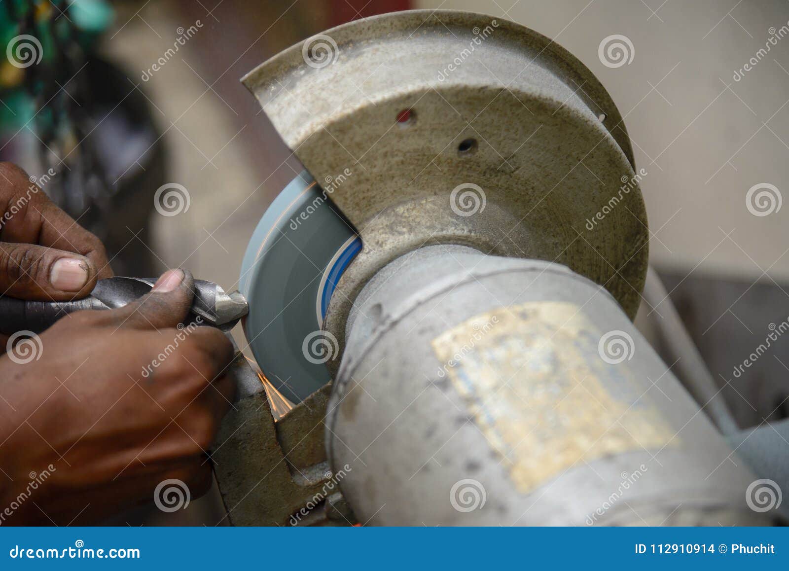 The Machine Operator Regrinding the Drill Tool Stock Photo - Image of ...