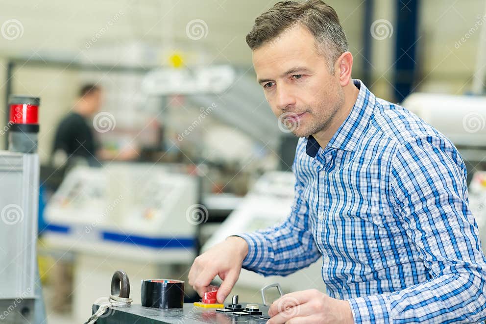 Machine Operator Turning Knob Stock Photo - Image of metal, panel ...