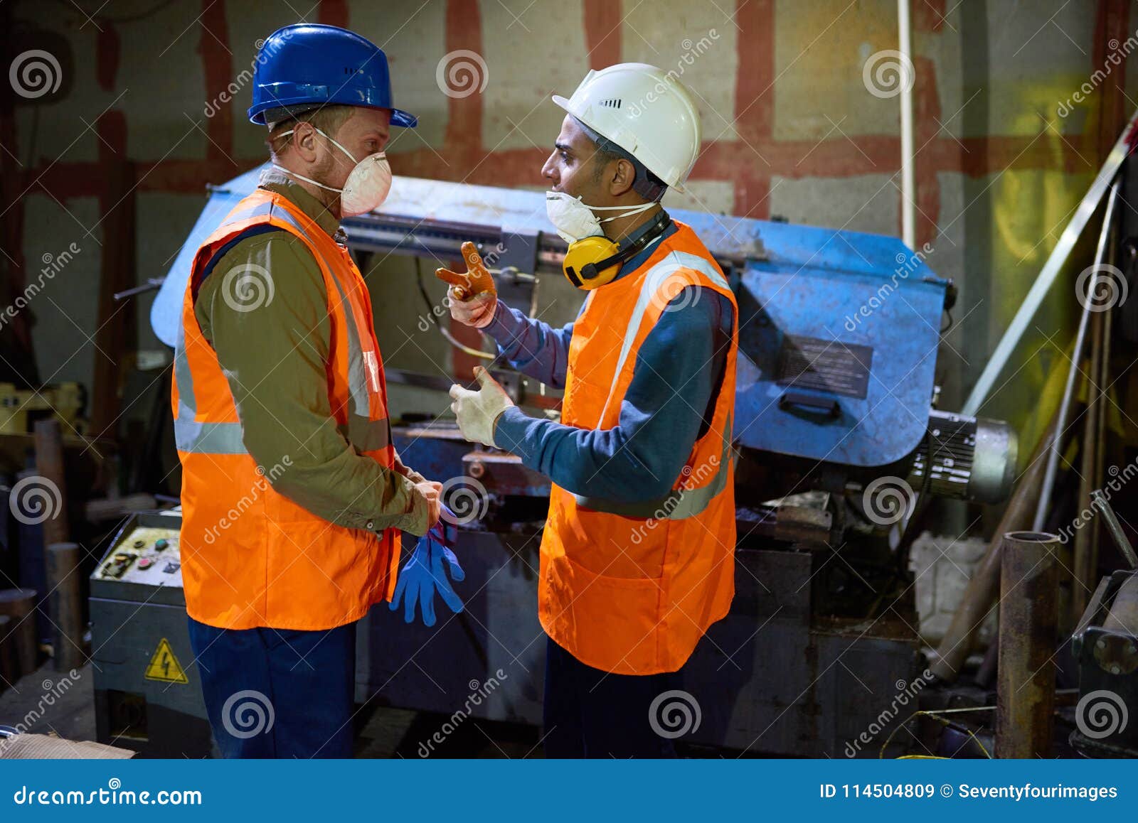 Machine Operators Wrapped Up in Discussion Stock Image - Image of ...