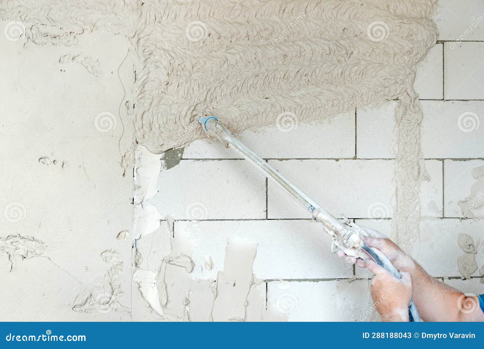 Machine Plastering. Applying Gypsum Plaster by Mechanized Method on the ...