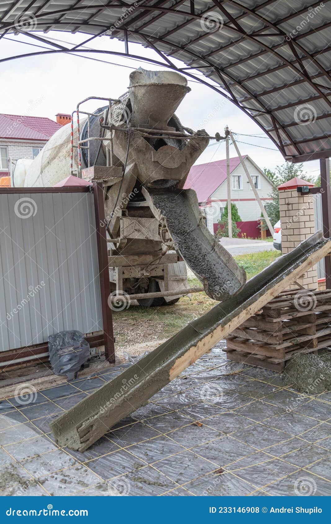 The Machine is Pouring Concrete Mix at a Construction Site. Stock Photo ...