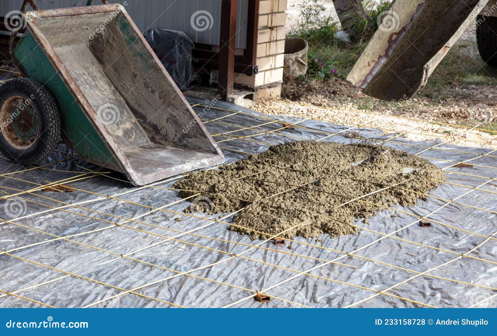 The Machine is Pouring Concrete Mix at a Construction Site. Stock Photo ...