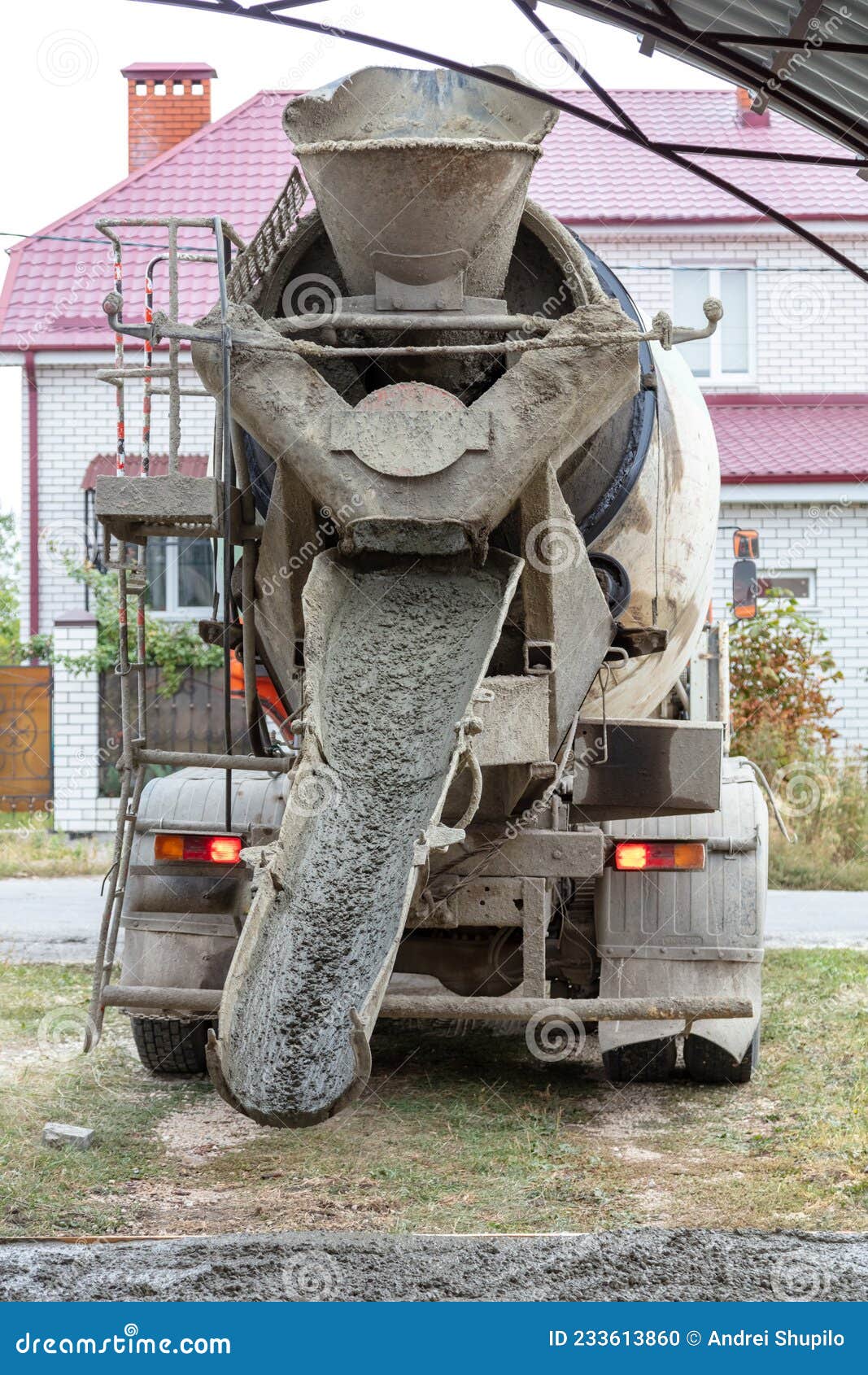 The Machine is Pouring Concrete Mix at a Construction Site. Stock Photo ...