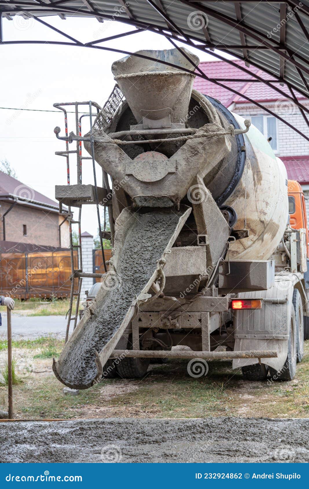 The Machine is Pouring Concrete Mix at a Construction Site. Stock Photo ...