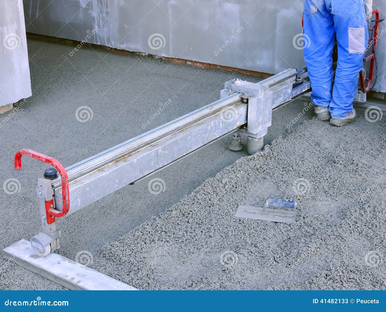 Machine Running Screed Flooring. Worker At Construction Site Sand And ...