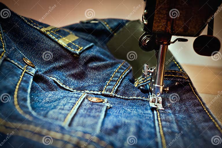 A machine sewing a jean stock photo. Image of machine - 74063834