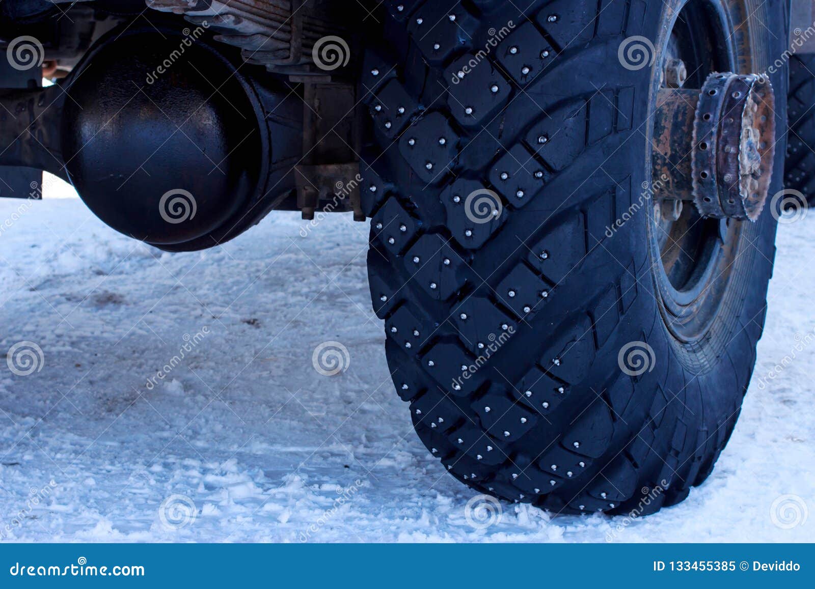Studded tires on snow stock image. Image of steel, close - 133455385