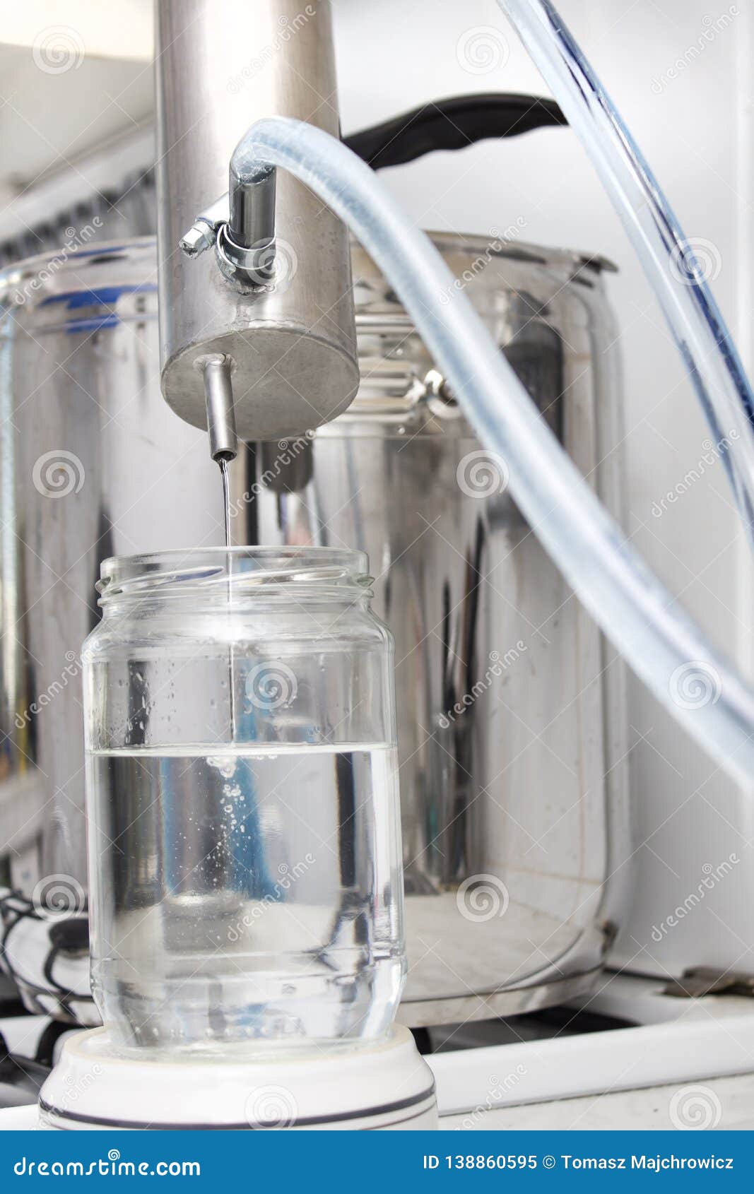 Silver Distillation Machine is Standing on the Burner in the Kitchen ...