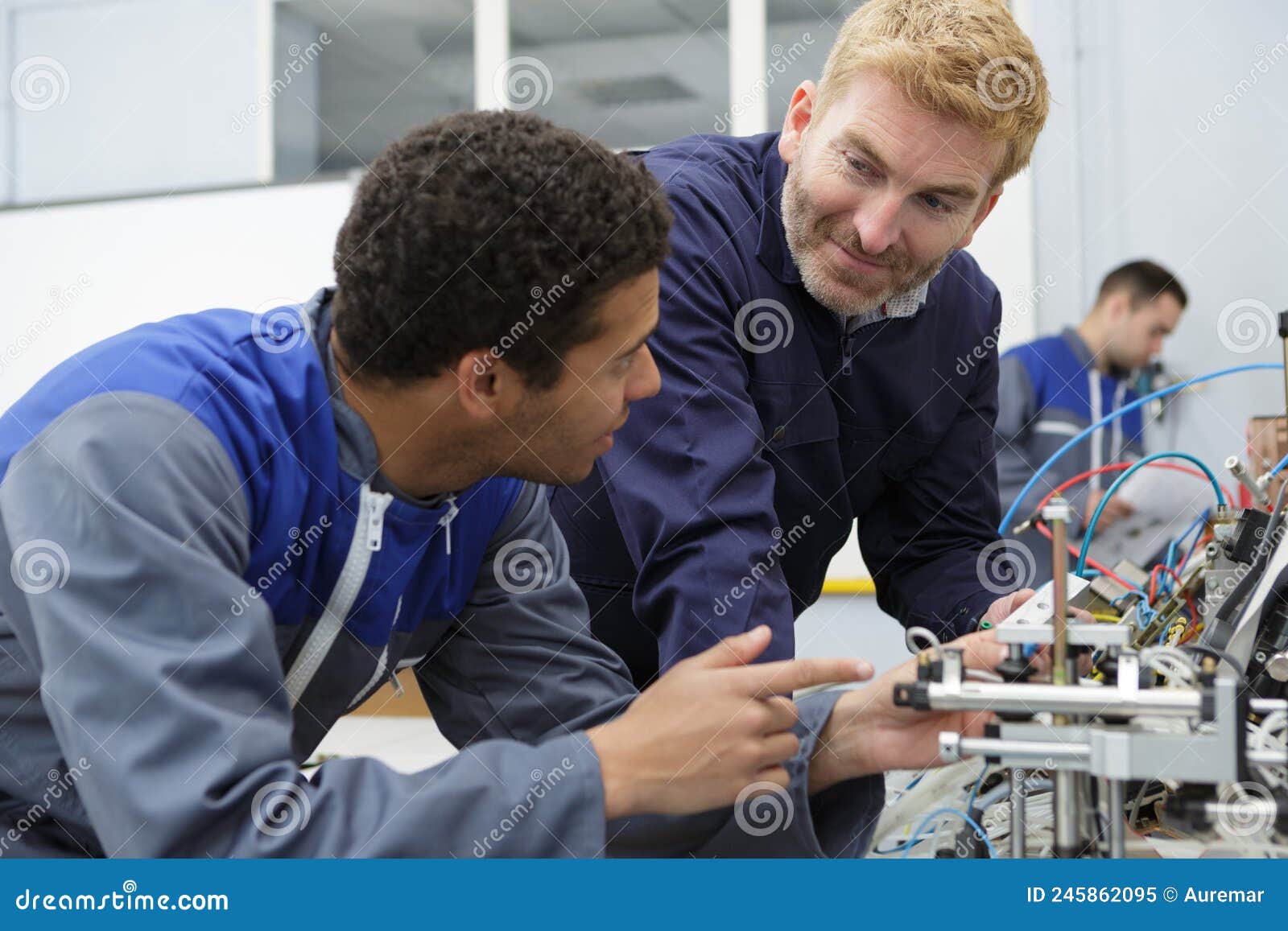 Machinery Repairman and Apprentice in Garage Stock Image - Image of ...