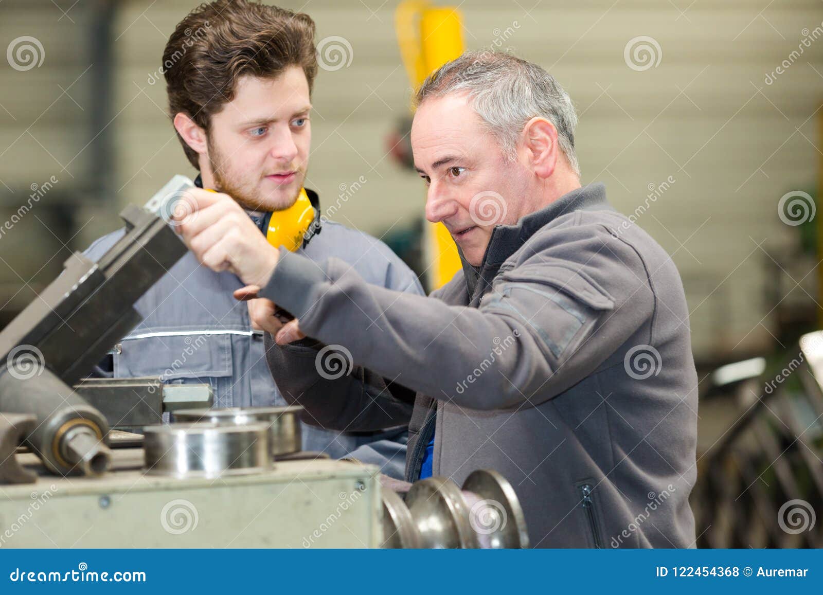 Machinery Repairman Worker and Apprentice Stock Photo - Image of ...