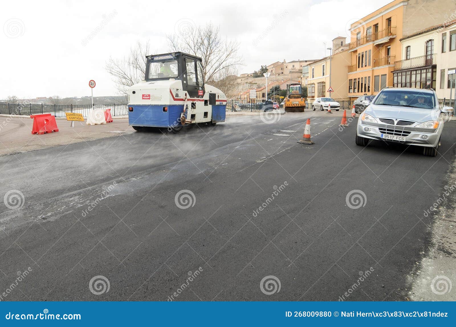 Machines Performing Asphalting and Paving Work on a City Road ...