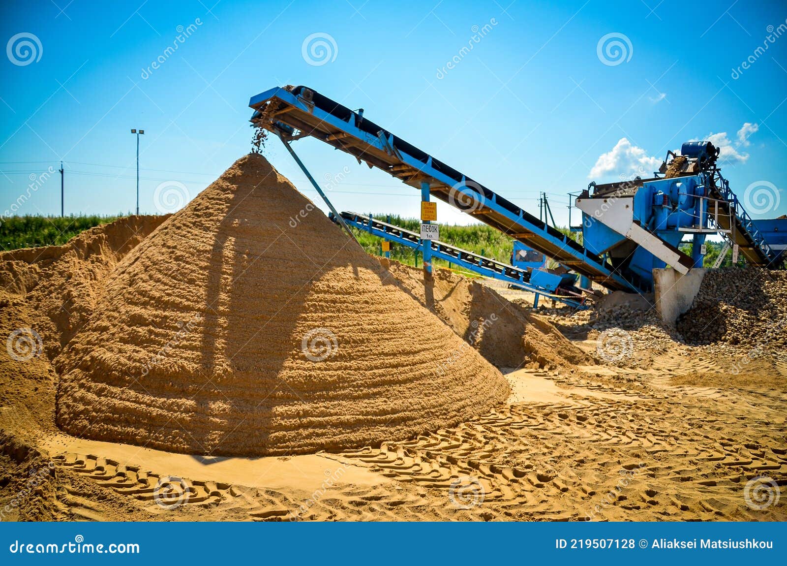 Machines Work on Loading and Unloading Material for the Production of ...