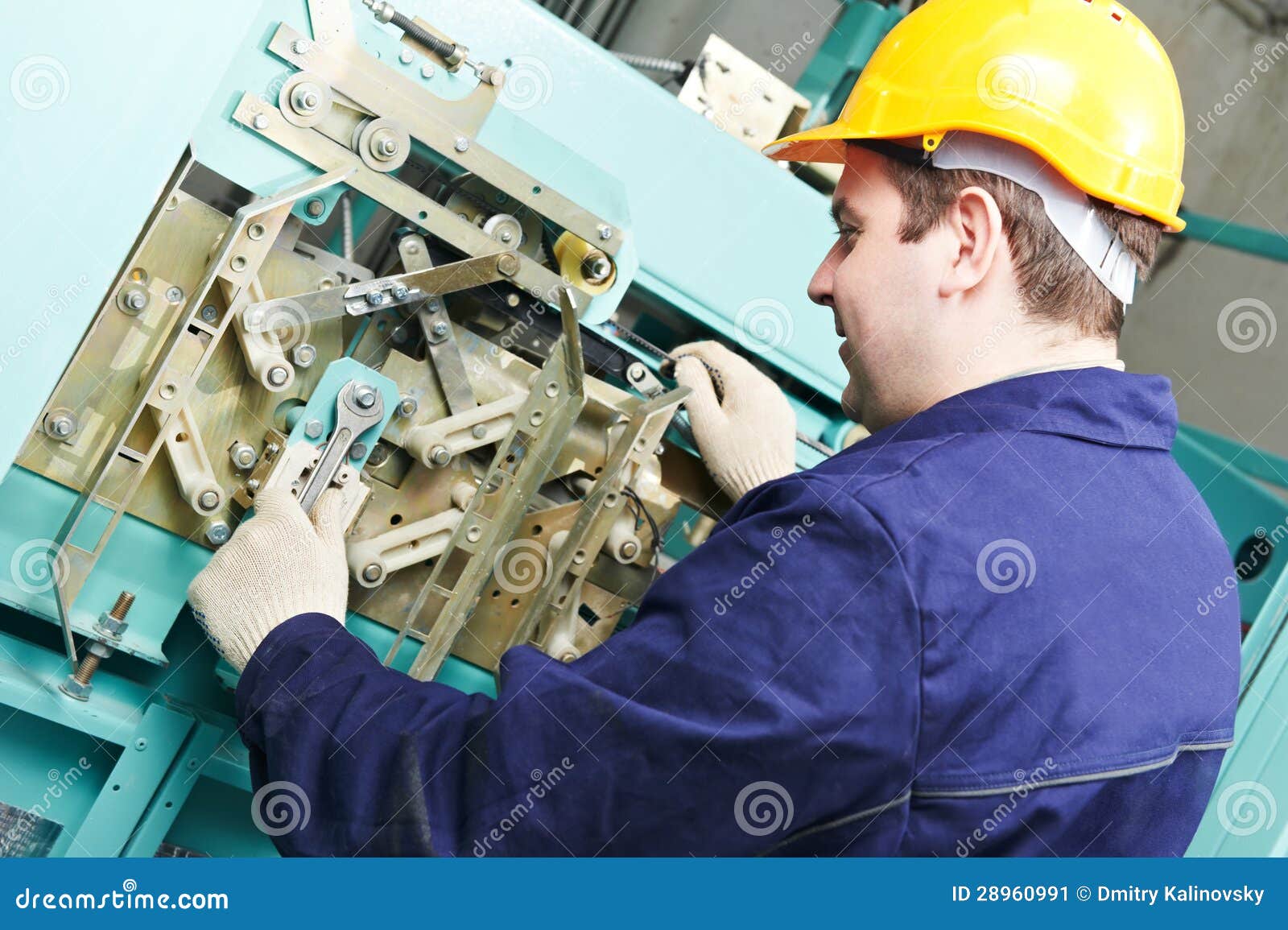 Machinist with Spanner Adjusting Lift Mechanism Stock Image - Image of ...