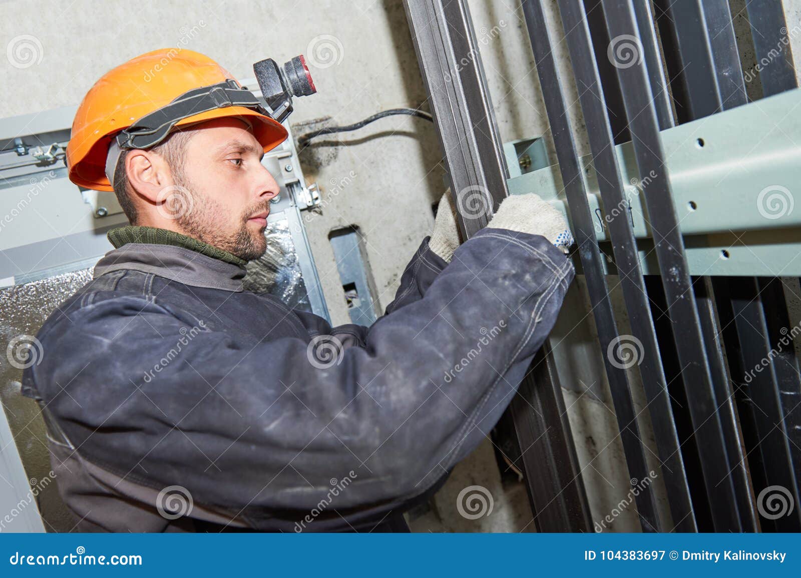 Machinist with Spanner Adjusting Lift Mechanism in Elevator Shaft Stock ...