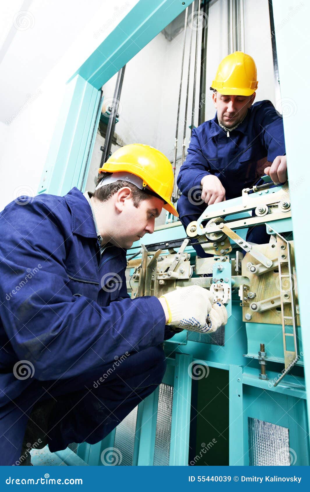 Machinist with Spanner Adjusting Lift Mechanism Stock Image - Image of ...