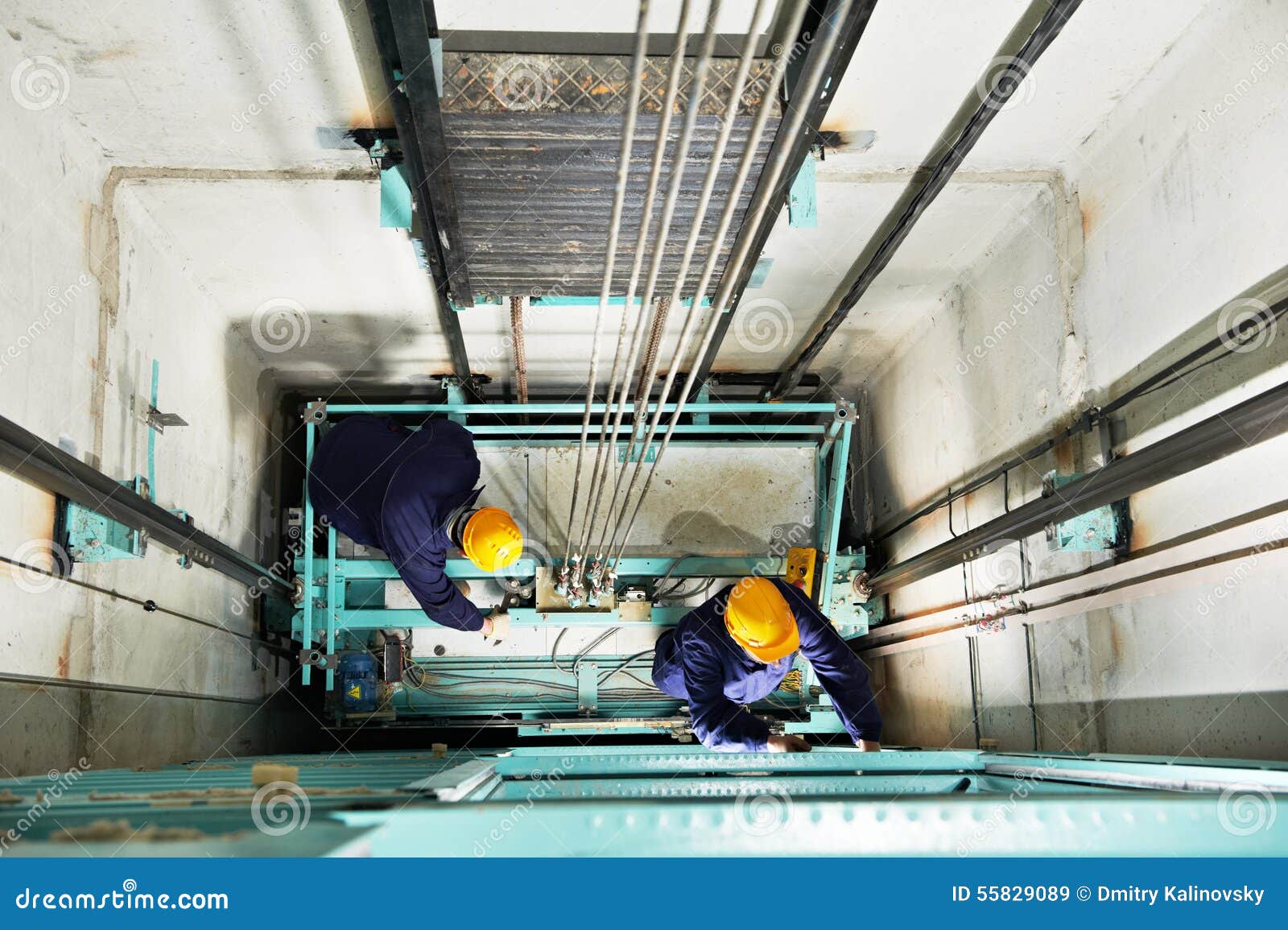 Machinist with Spanner Adjusting Lift Mechanism Stock Image - Image of ...