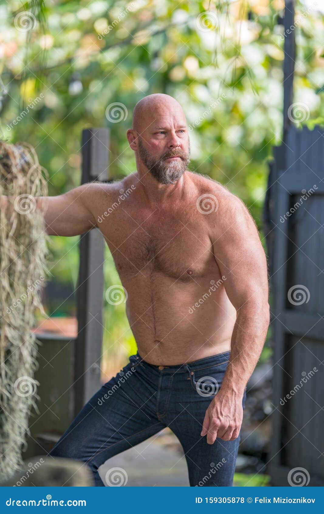 Macho Man Posing without a Shirt in the Backyard Stock Photo - Image of ...
