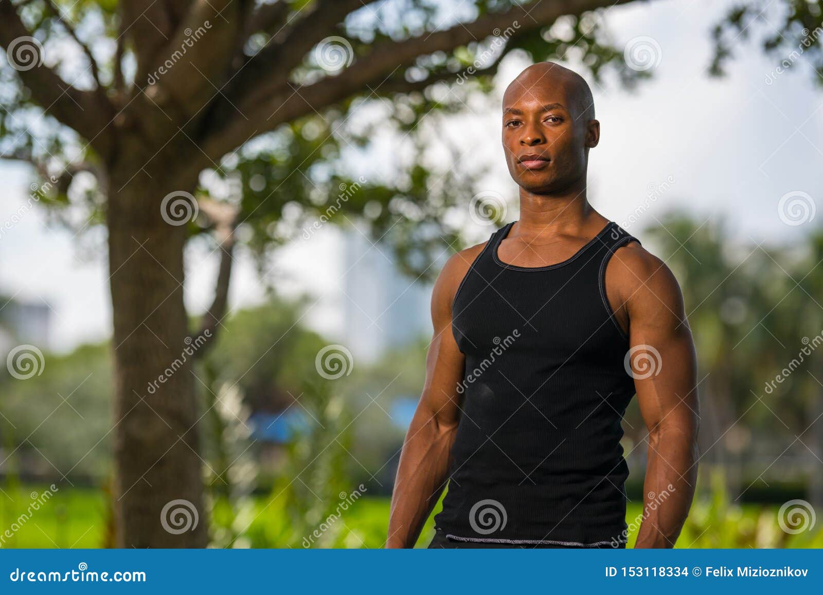 Macho Man Posing in a Tank Top Shirt Stock Photo - Image of buff ...
