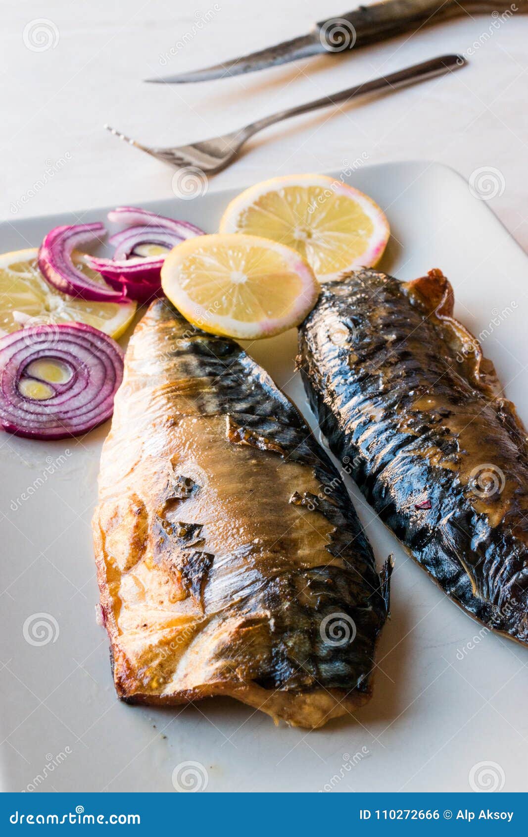 Mackerel Fish with Onions and Lemons in Plate. Stock Photo - Image of ...