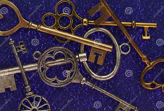 Macro of Assorted Vintage Gold and Silver Keys on Blue Background Stock ...