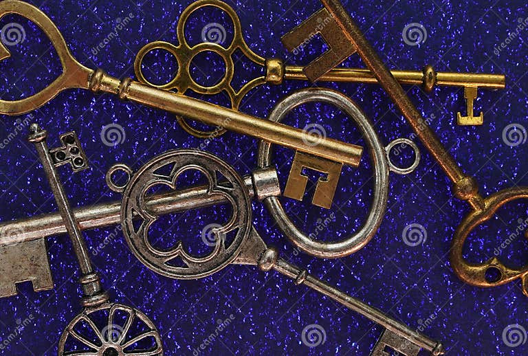 Macro of Assorted Vintage Gold and Silver Keys on Blue Background Stock ...