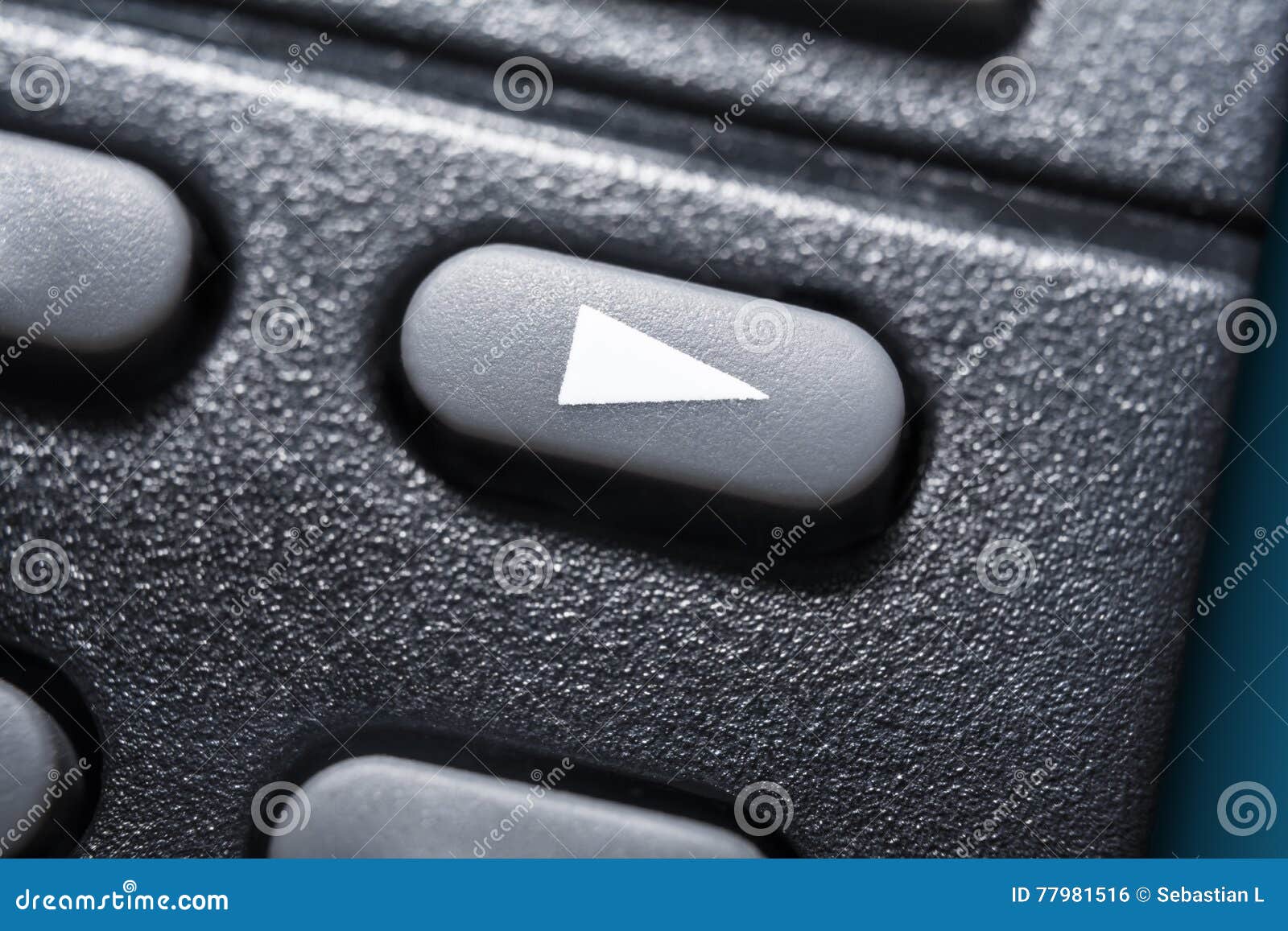 Macro of a Black Play Button on Black Remote Control for a Hifi Stereo ...