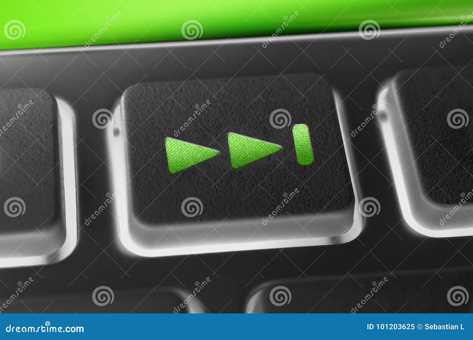 Macro of a Black Skip Forward Button of a Black Remote Control with ...