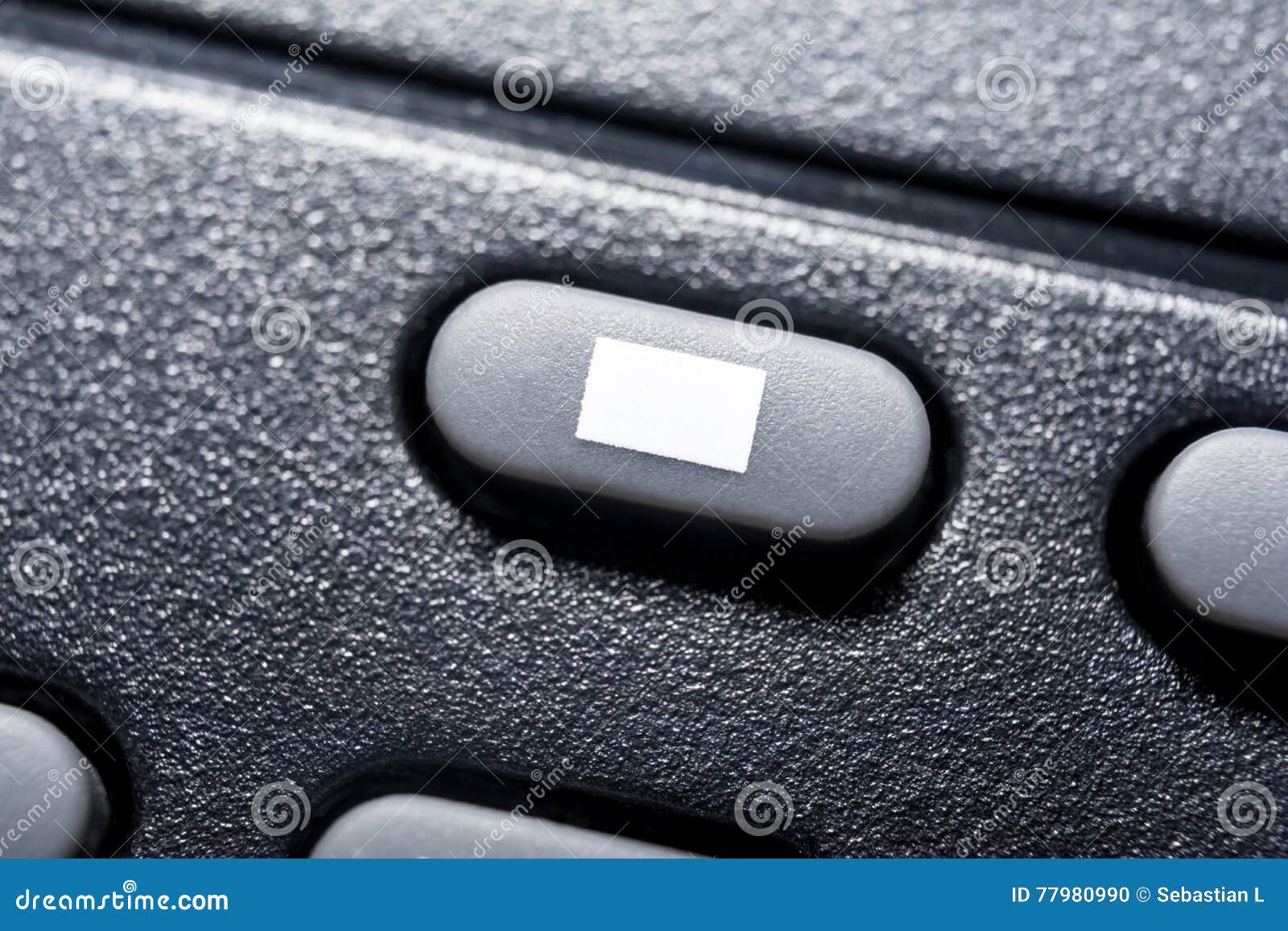 Macro of a Black Stop Button on Black Remote Control for a Hifi Stereo ...