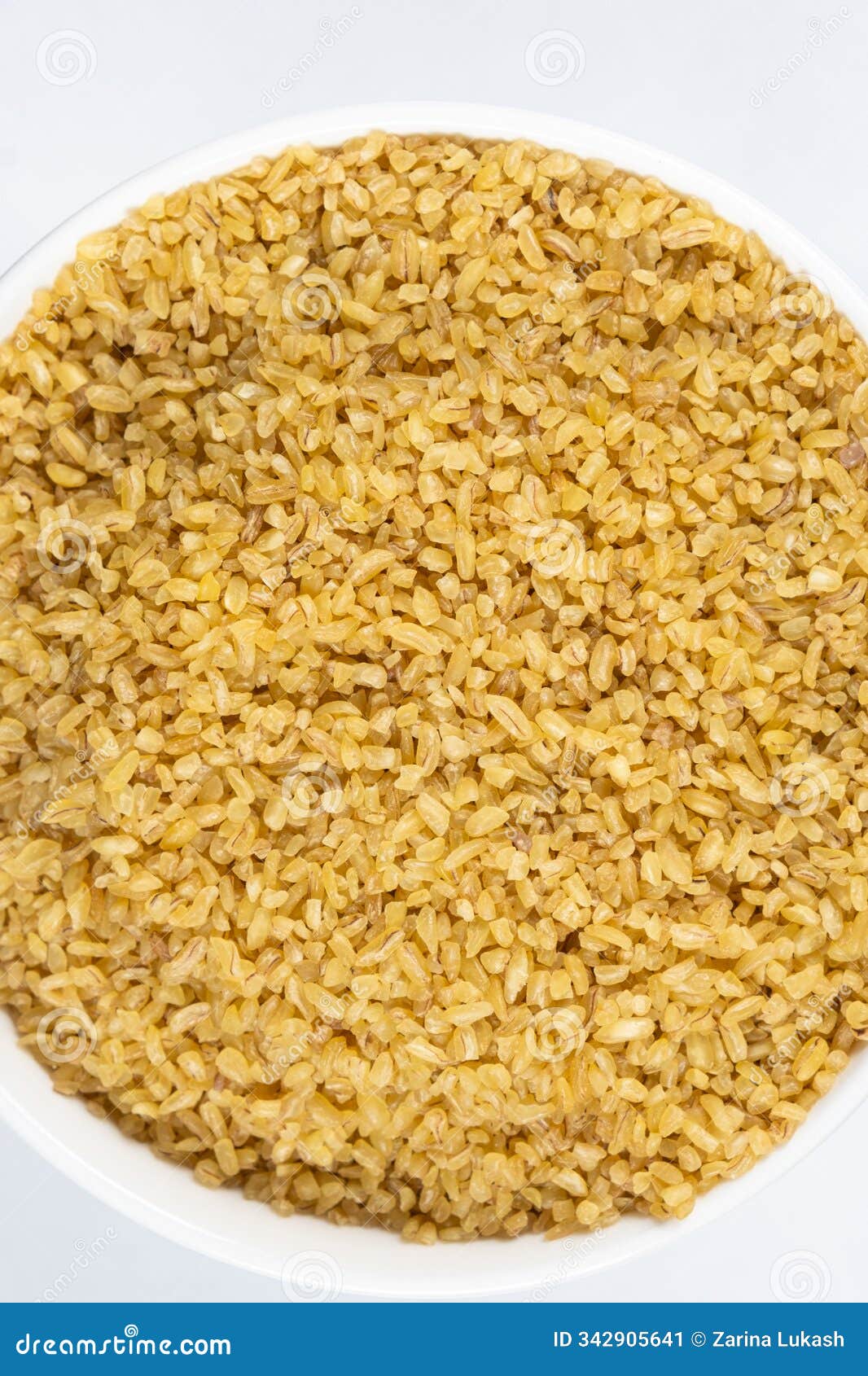 Macro Bulgur Cracked Wheat in a Plate on a White Background Stock Image ...