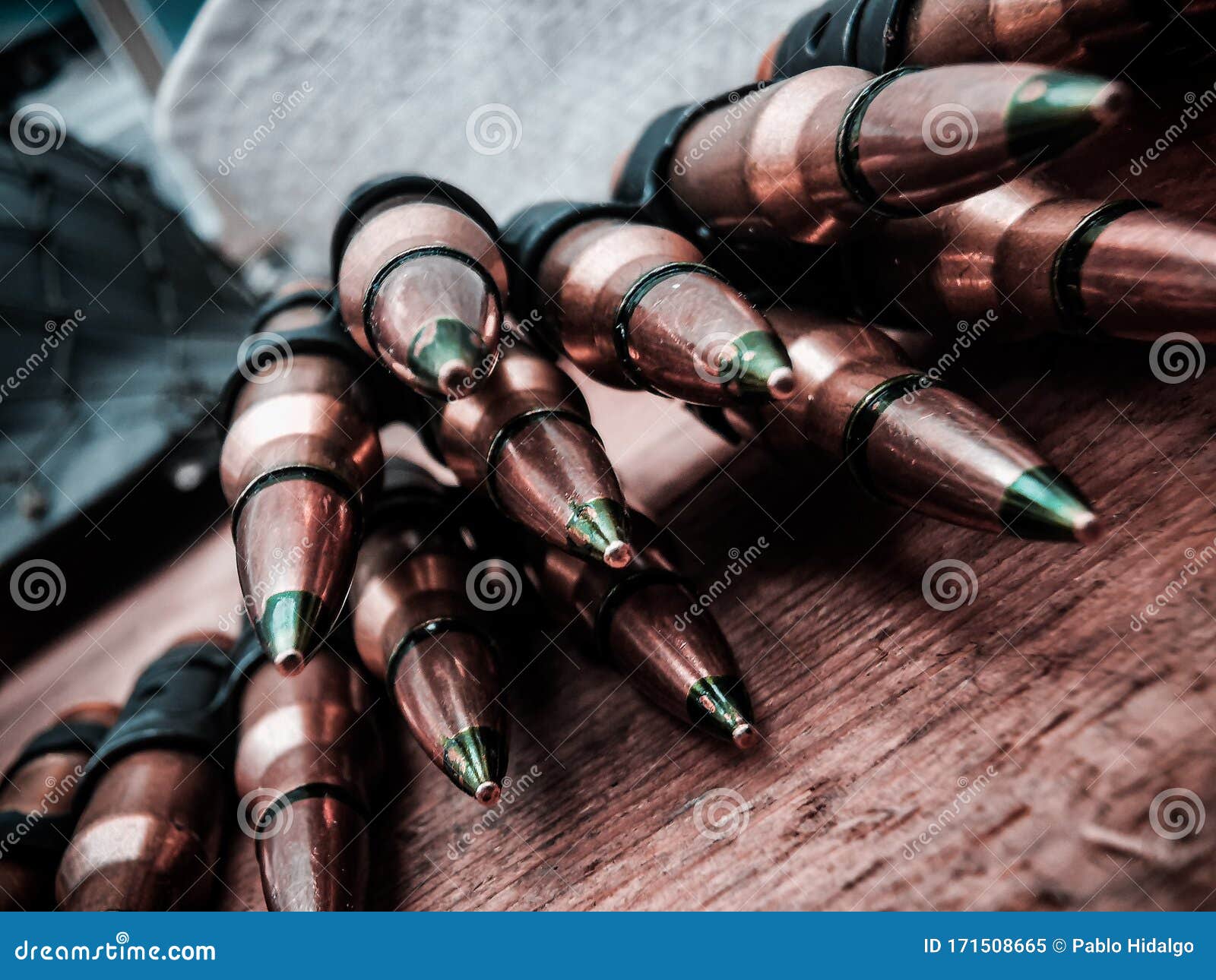 A Macro Close Up View of a Row of Regular Army Brass and Copper Bullets ...