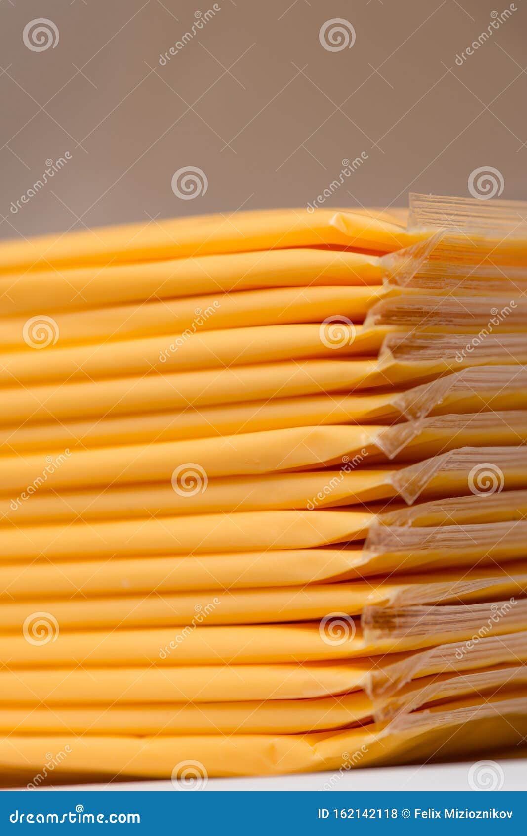 Macro Closeup Photo of Individually Packed Slices of Cheese Stock Photo ...