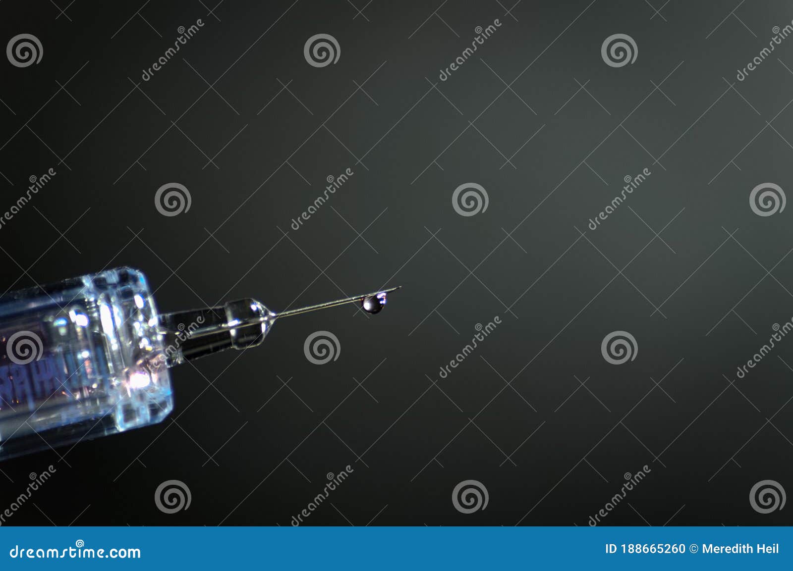 Macro of a Drop of Liquid that Came Out of a Needle on a Clear Syringe ...