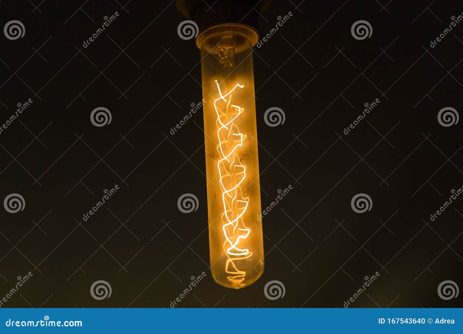 Filament of a Electric Light Bulb Stock Photo - Image of design, dark ...