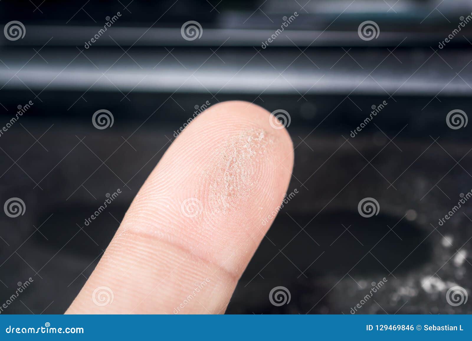 Macro of a Finger Streaked through Dust on a Black Surface Stock Photo ...