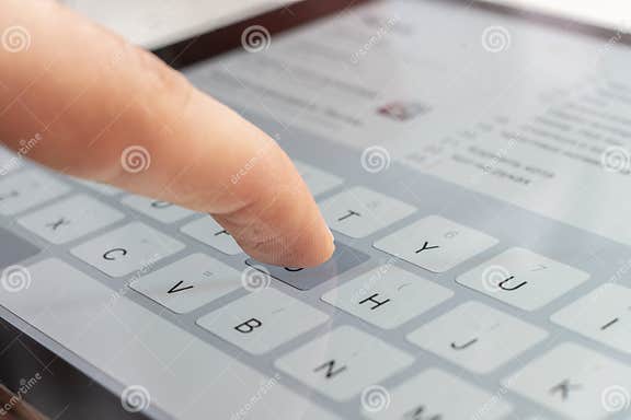 A Macro of a Finger Typing Text on the Touch Screen Keyboard of Mobile ...