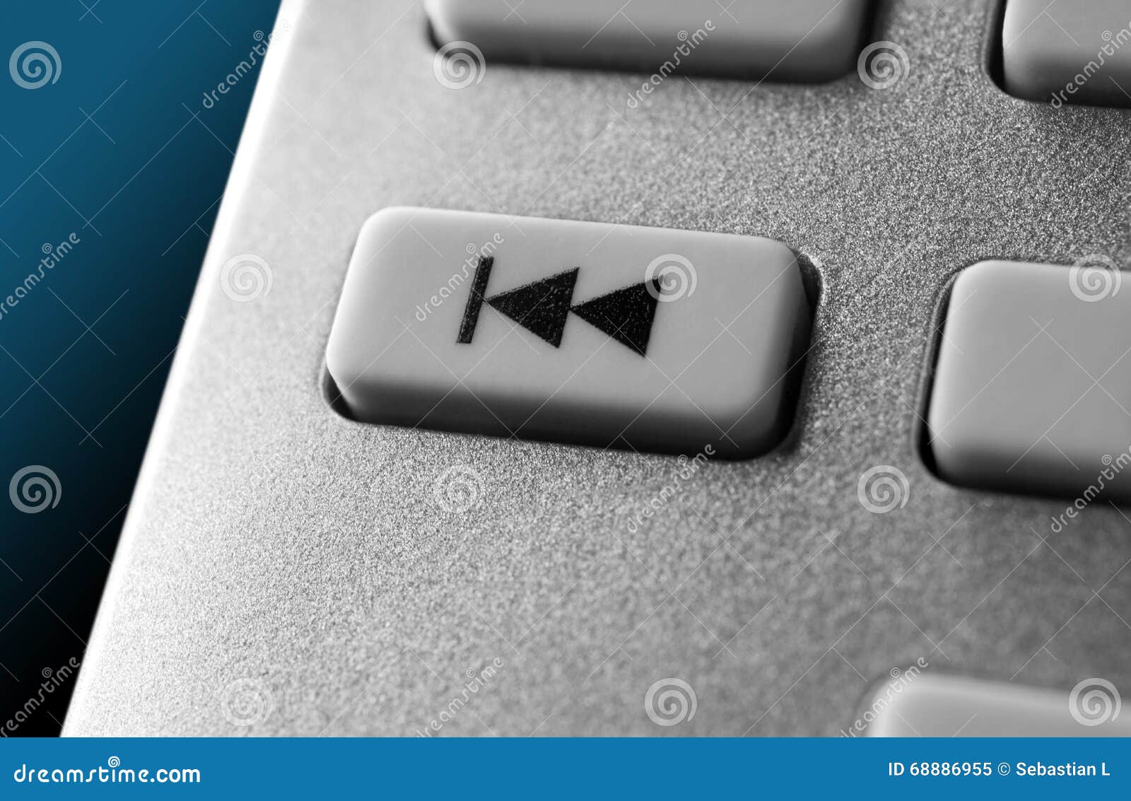 Macro of a Grey Skip Backward Button on Chrome Remote Control for a ...