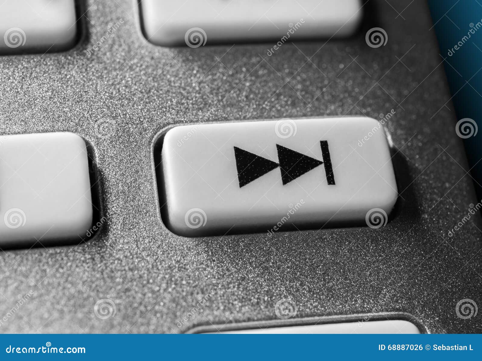 Macro of a Grey Skip Forward Button on Chrome Remote Control for a Hifi ...