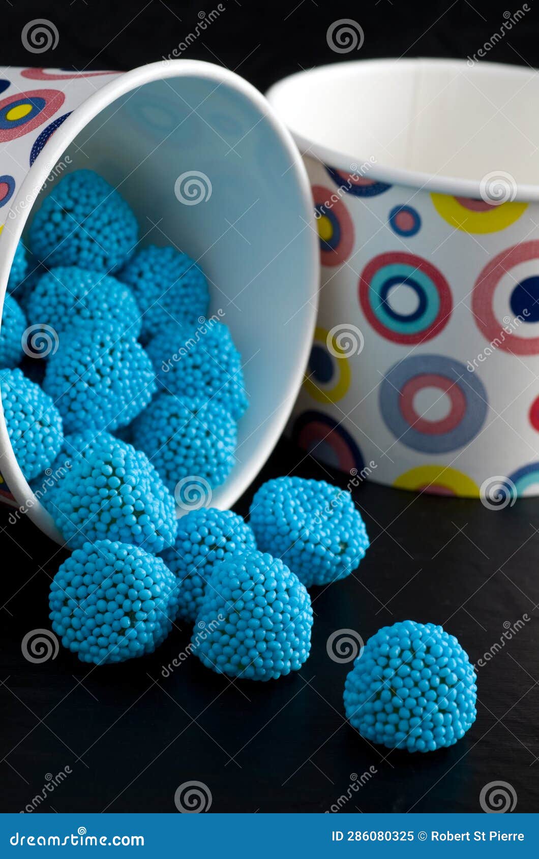 Macro Image of Blue Candies with Colorful Bowls on Black Stock Image ...