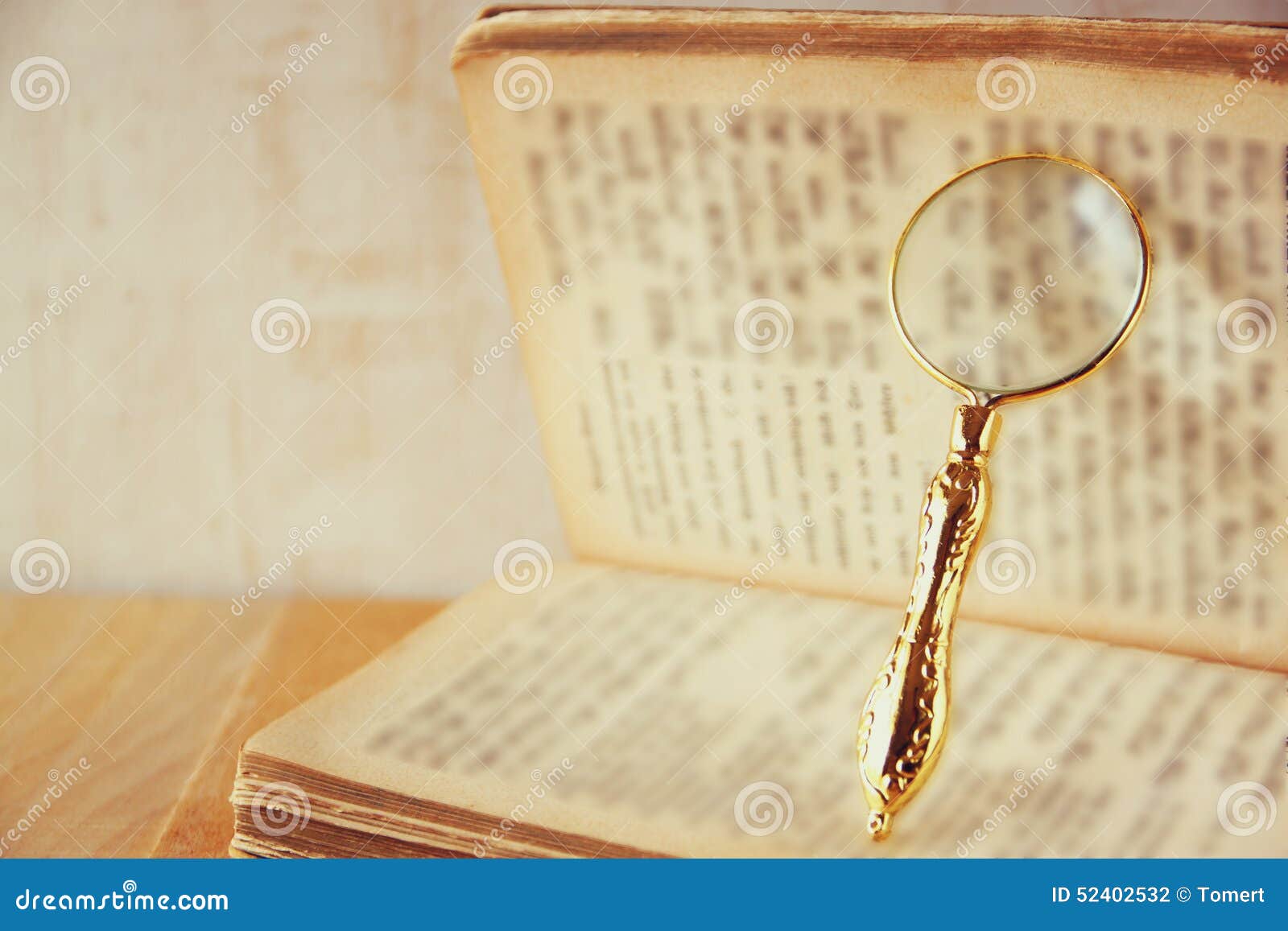 Macro Image of Magnifying Glass Over Antique Open Book. Stock Photo ...