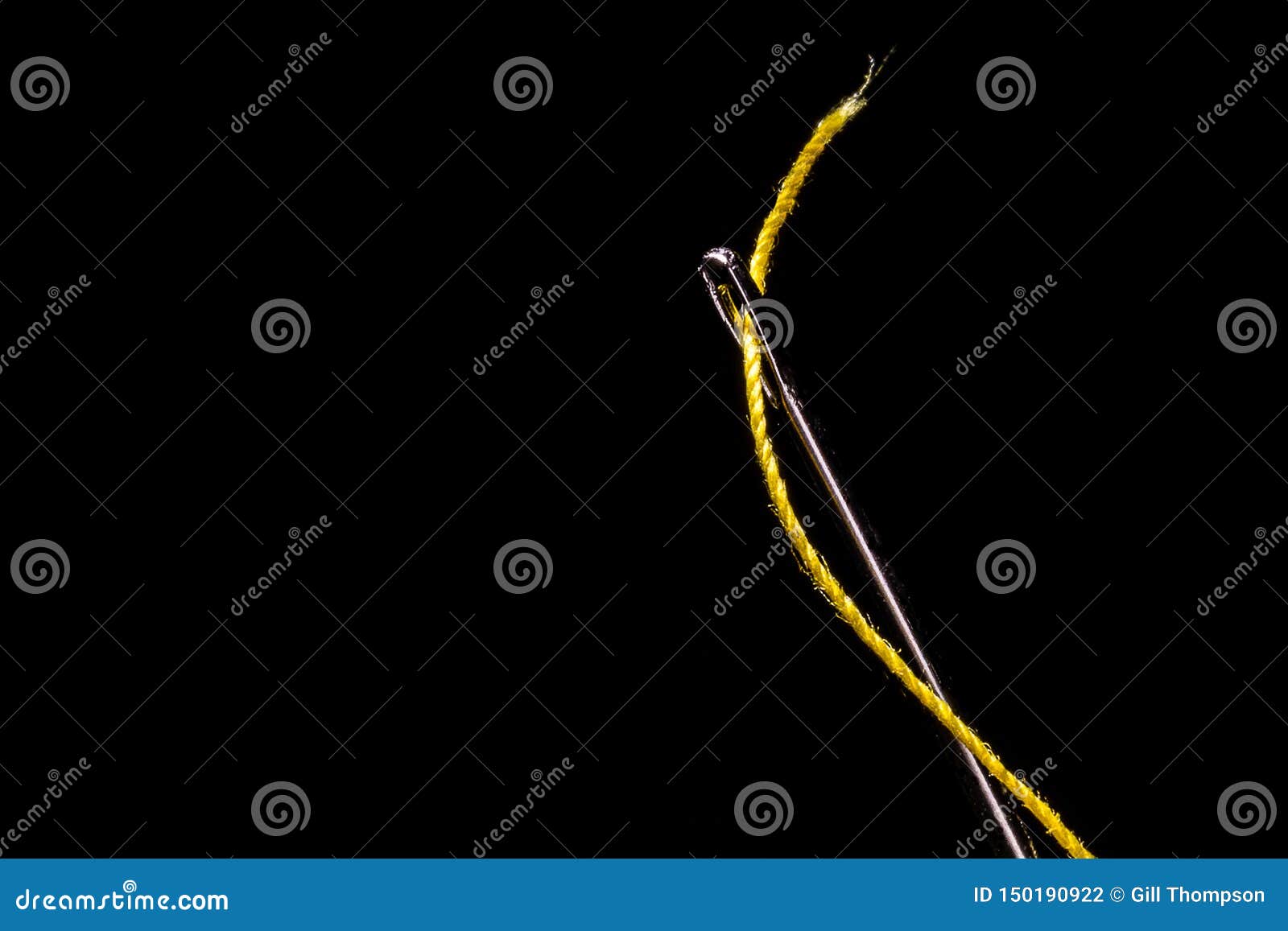 A Macro Image of a Needleâ€™s Eye Threaded with a Piece of Yellow ...