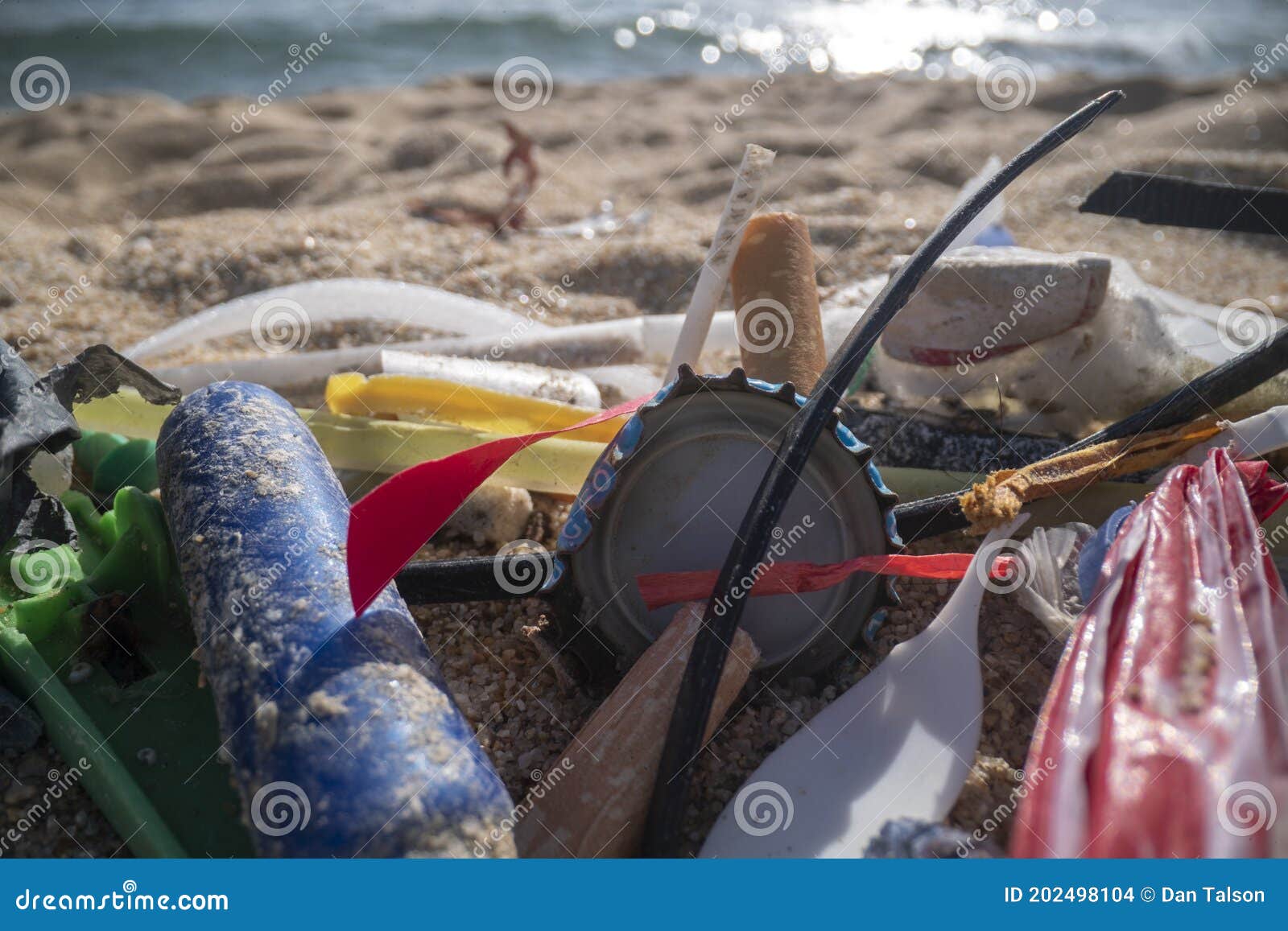 Plastic discarded on beach stock photo. Image of discard - 202498104