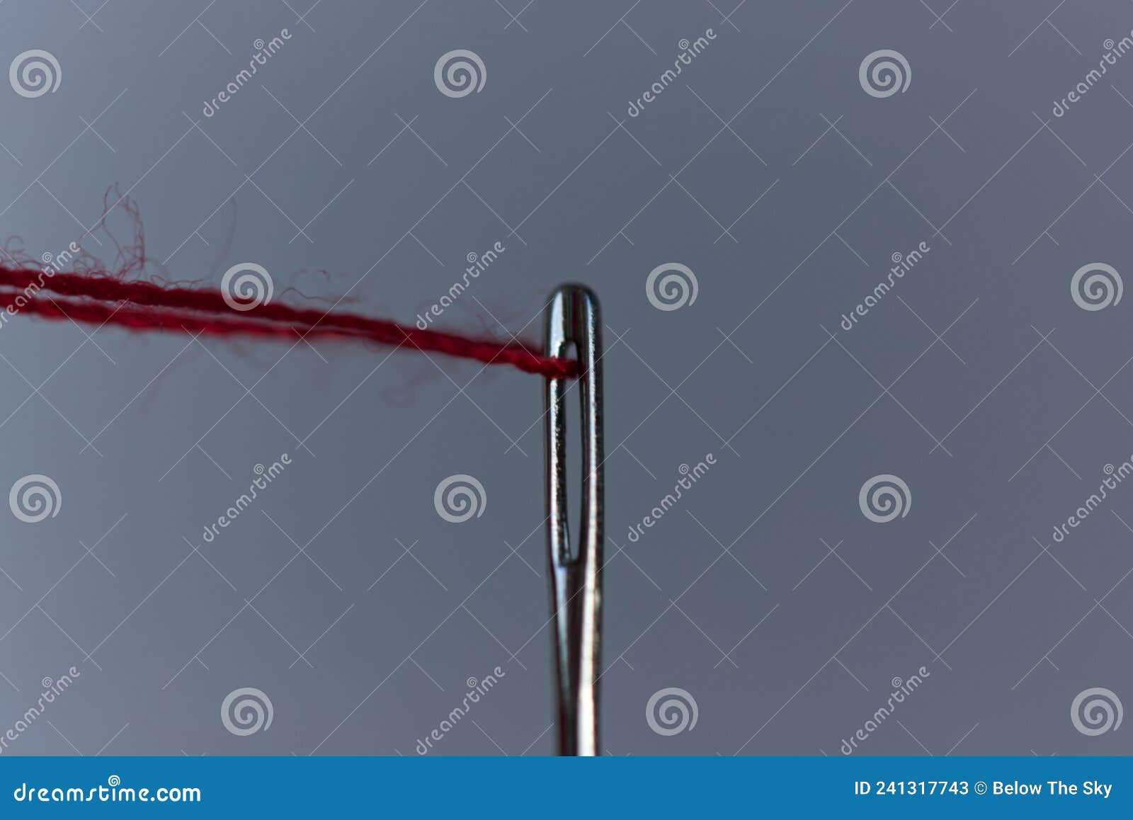 Macro Image of a Sewing Needle Eye and Red Thread Stock Image - Image ...