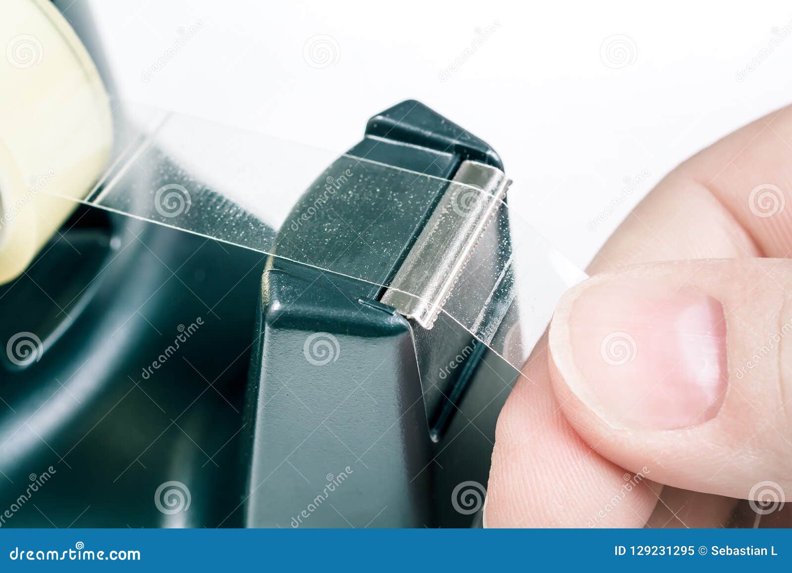 Macro of a Male Hand Pulling of Some Tape of a Sellotape Holder Stock ...