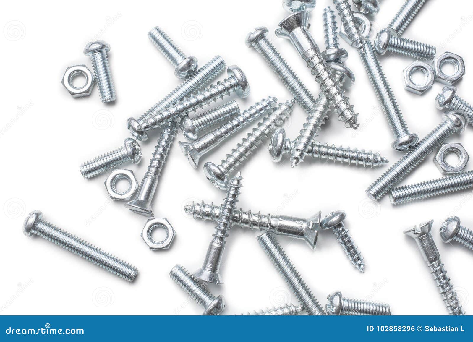 Macro of a Medium Size Collection of Iron Screws and Bolts in a ...